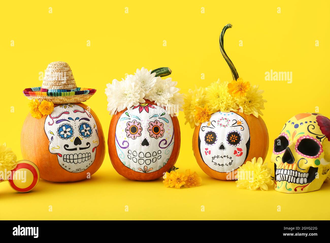 Pumpkins with painted skull on color background. Celebration of Mexico ...