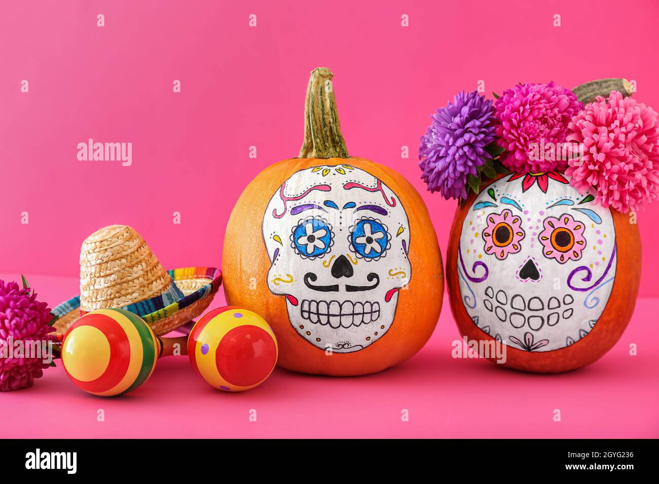 Pumpkins with painted skull on color background. Celebration of Mexico ...