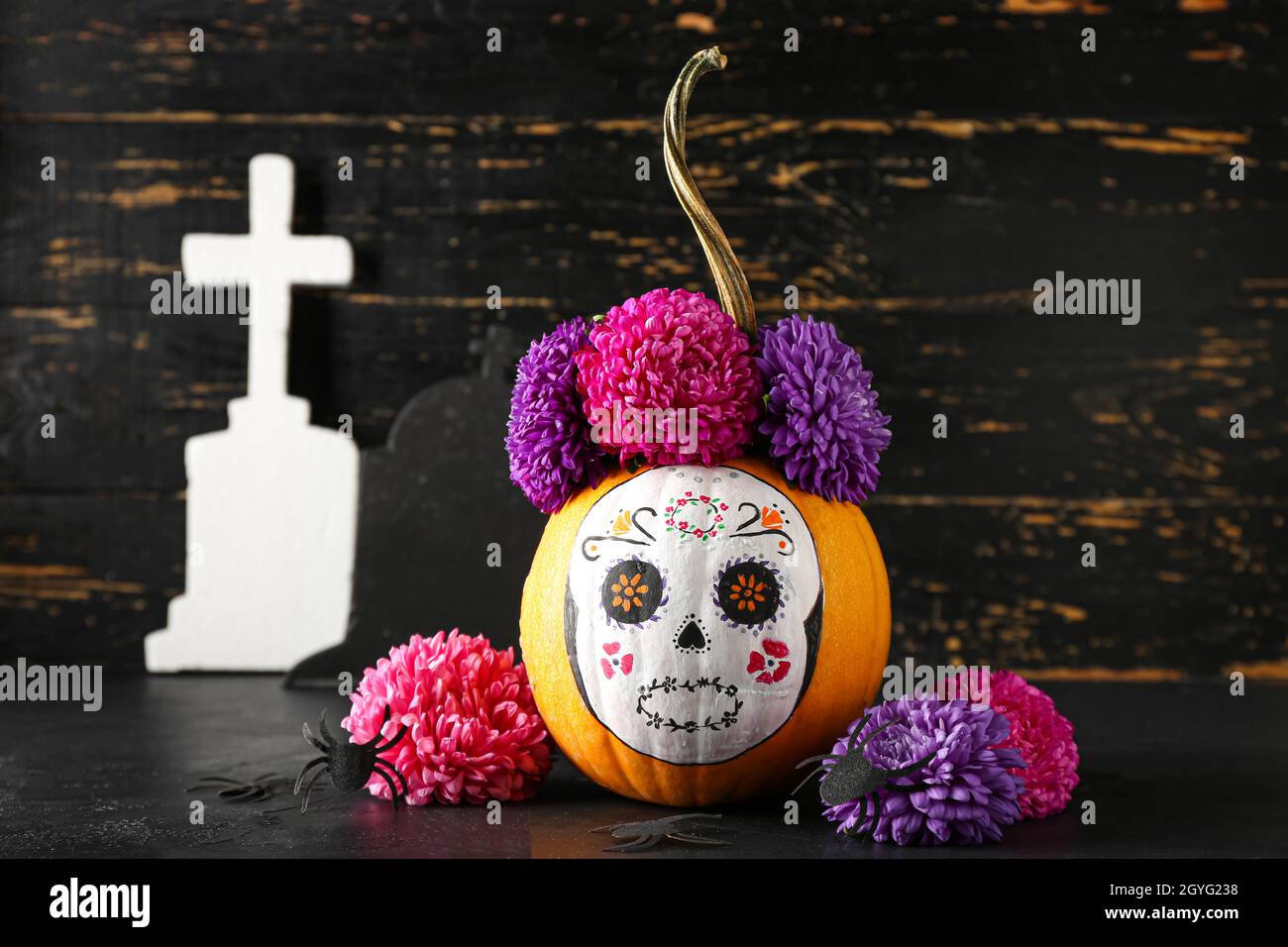 Pumpkin with painted skull on dark background. Celebration of Mexico's ...