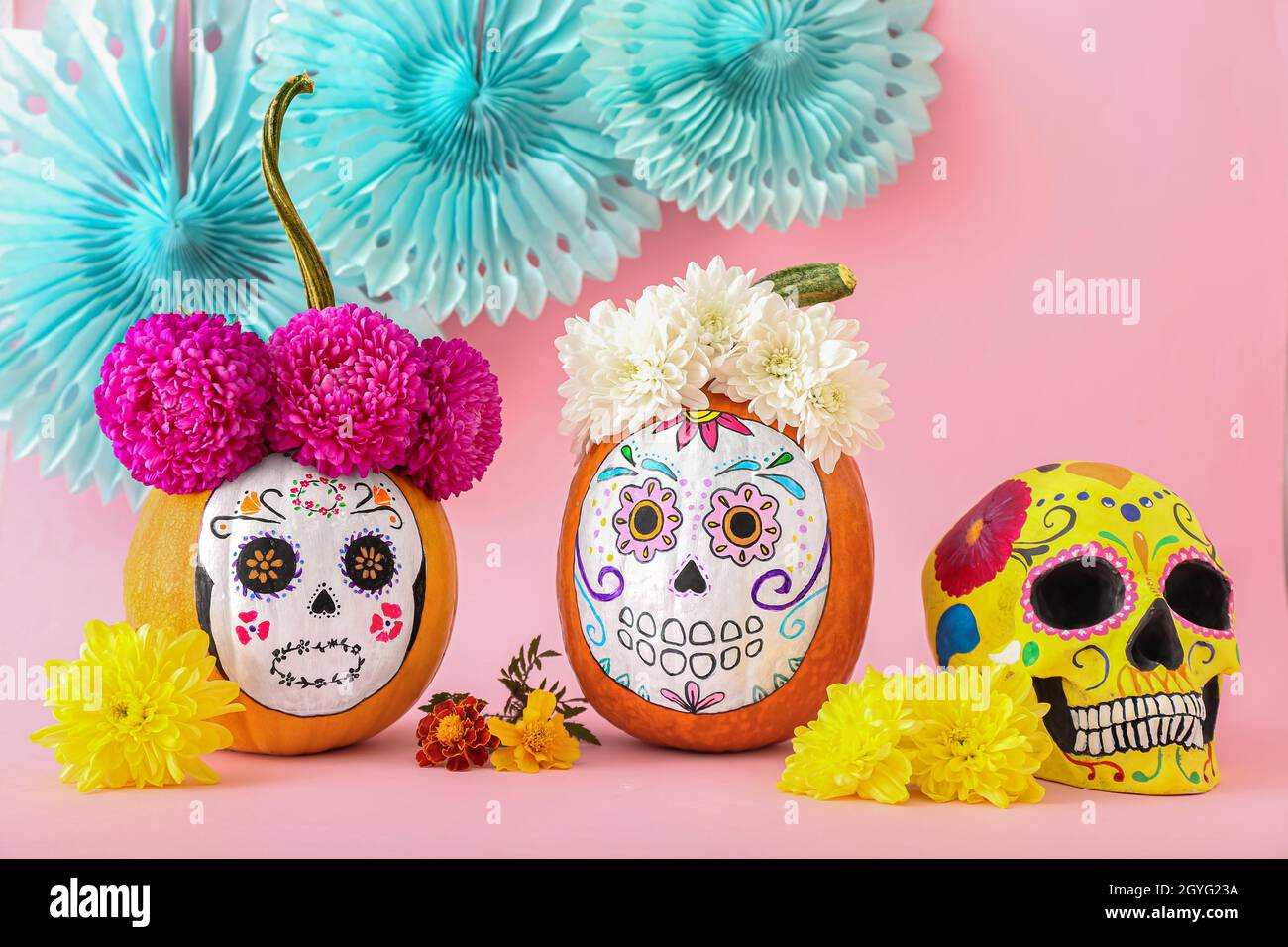 Pumpkins with painted skull on color background. Celebration of Mexico ...