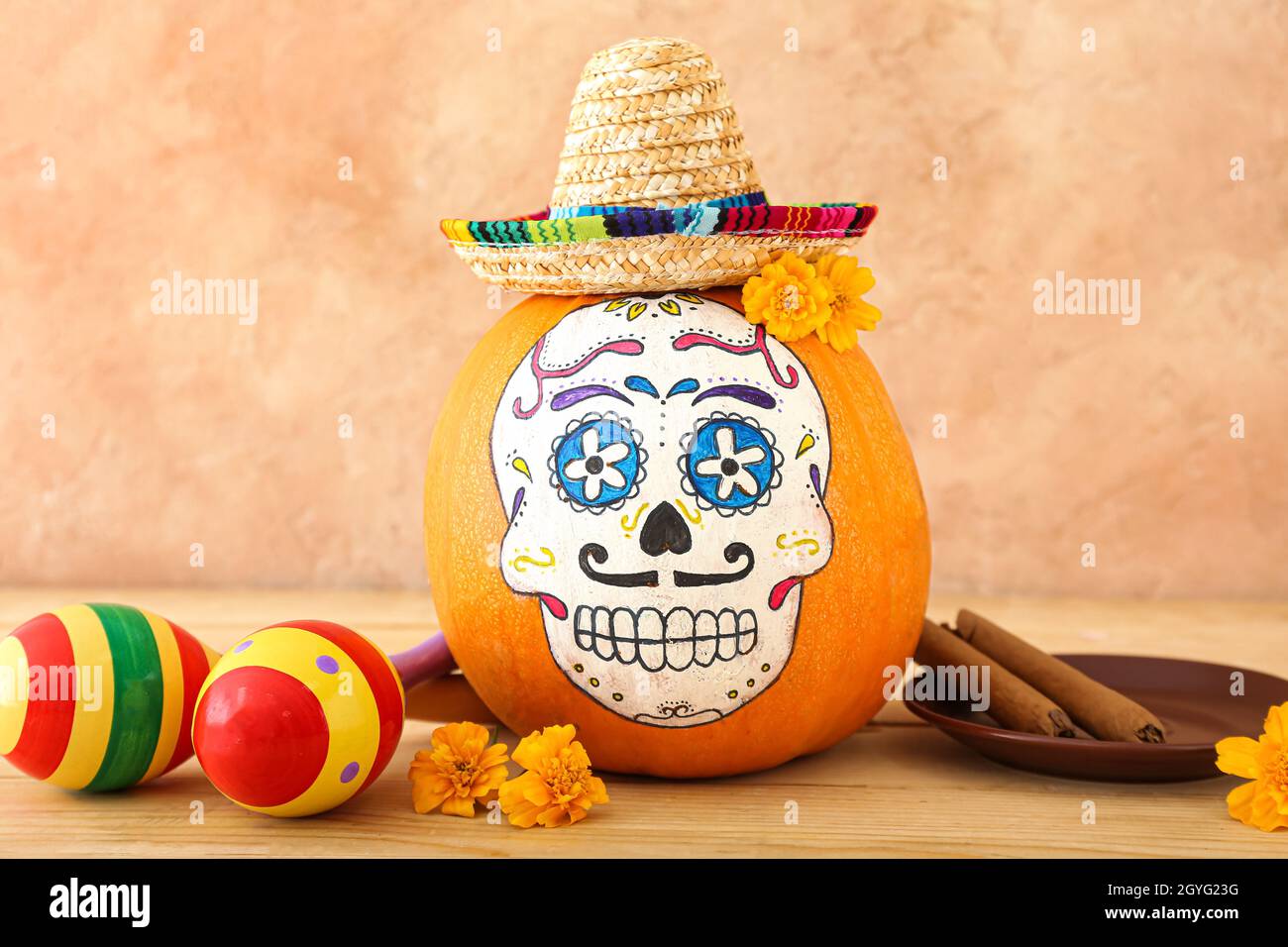 Pumpkin with painted skull on color background. Celebration of Mexico's ...