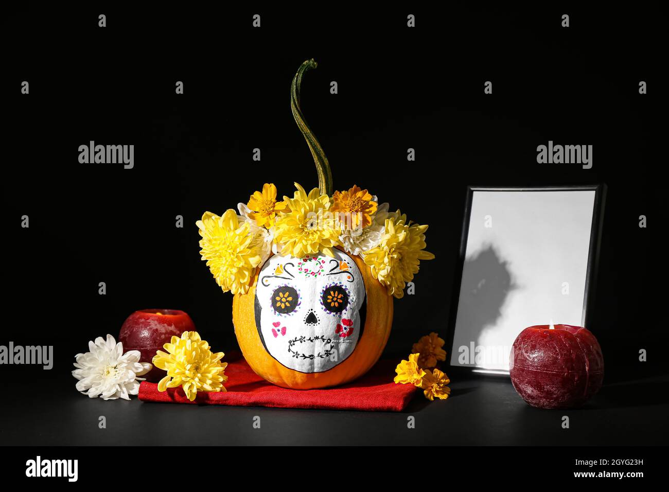 Pumpkin with painted skull on dark background. Celebration of Mexico's ...