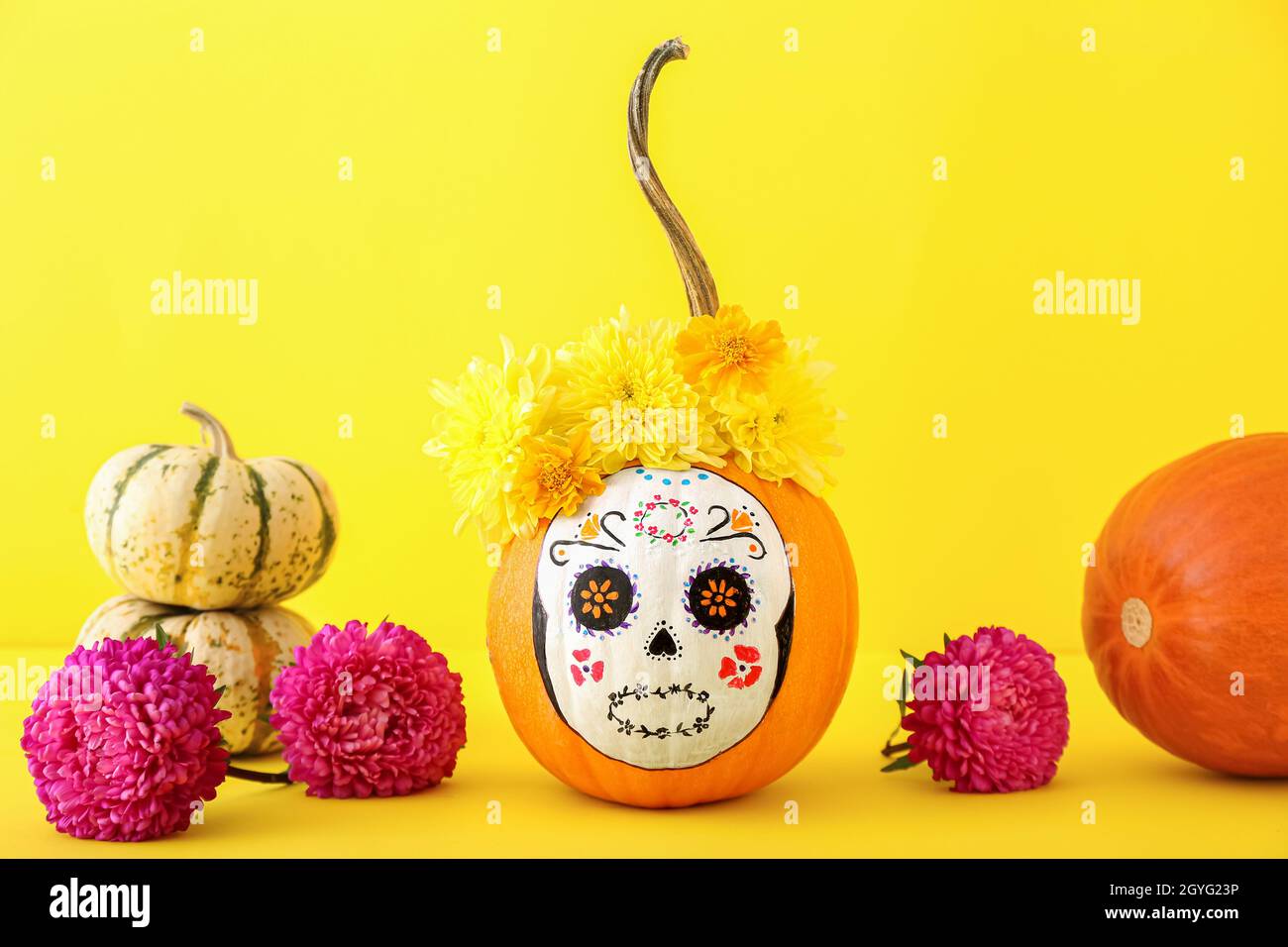 Pumpkin with painted skull on color background. Celebration of Mexico's ...