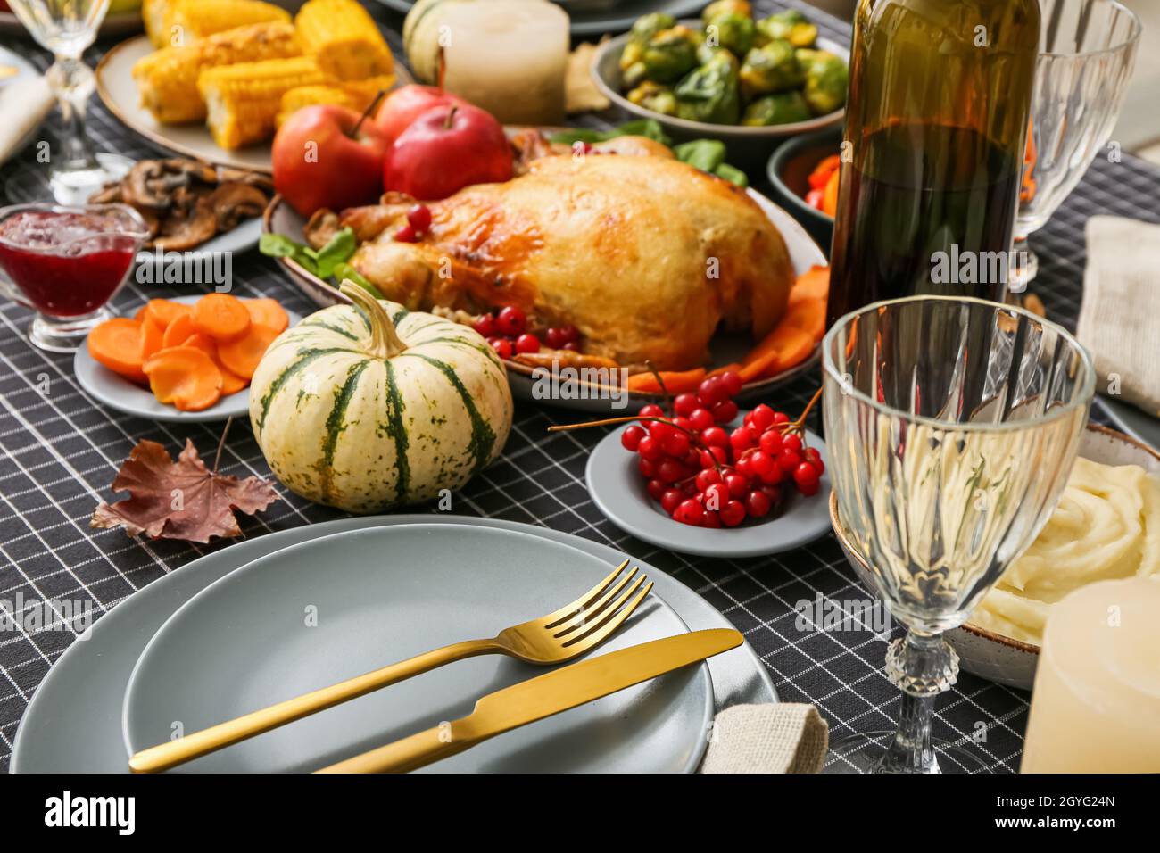 Table setting and traditional Thanksgiving food on served table Stock ...