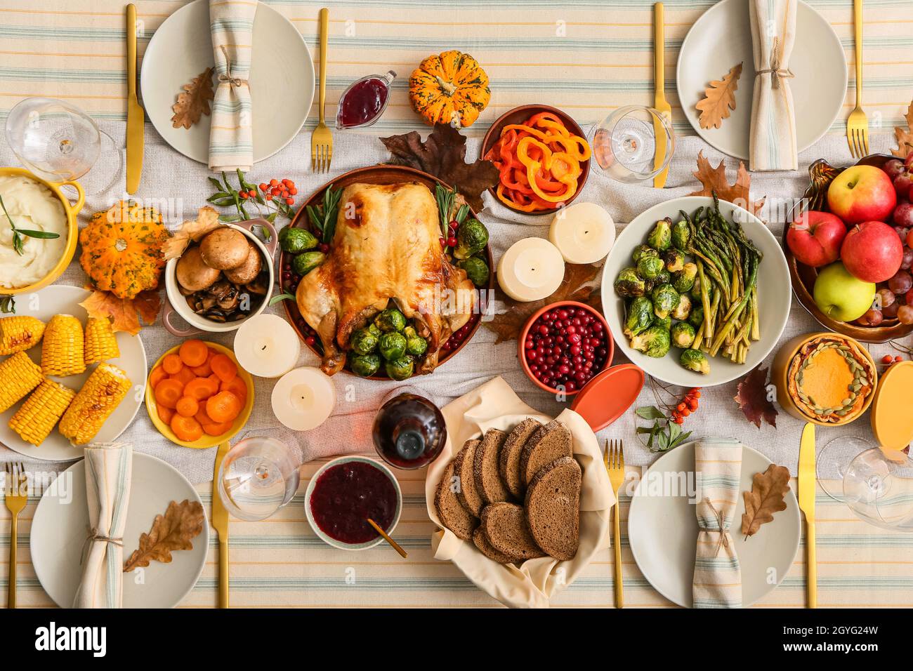 Table setting with delicious roasted turkey for Thanksgiving dinner ...