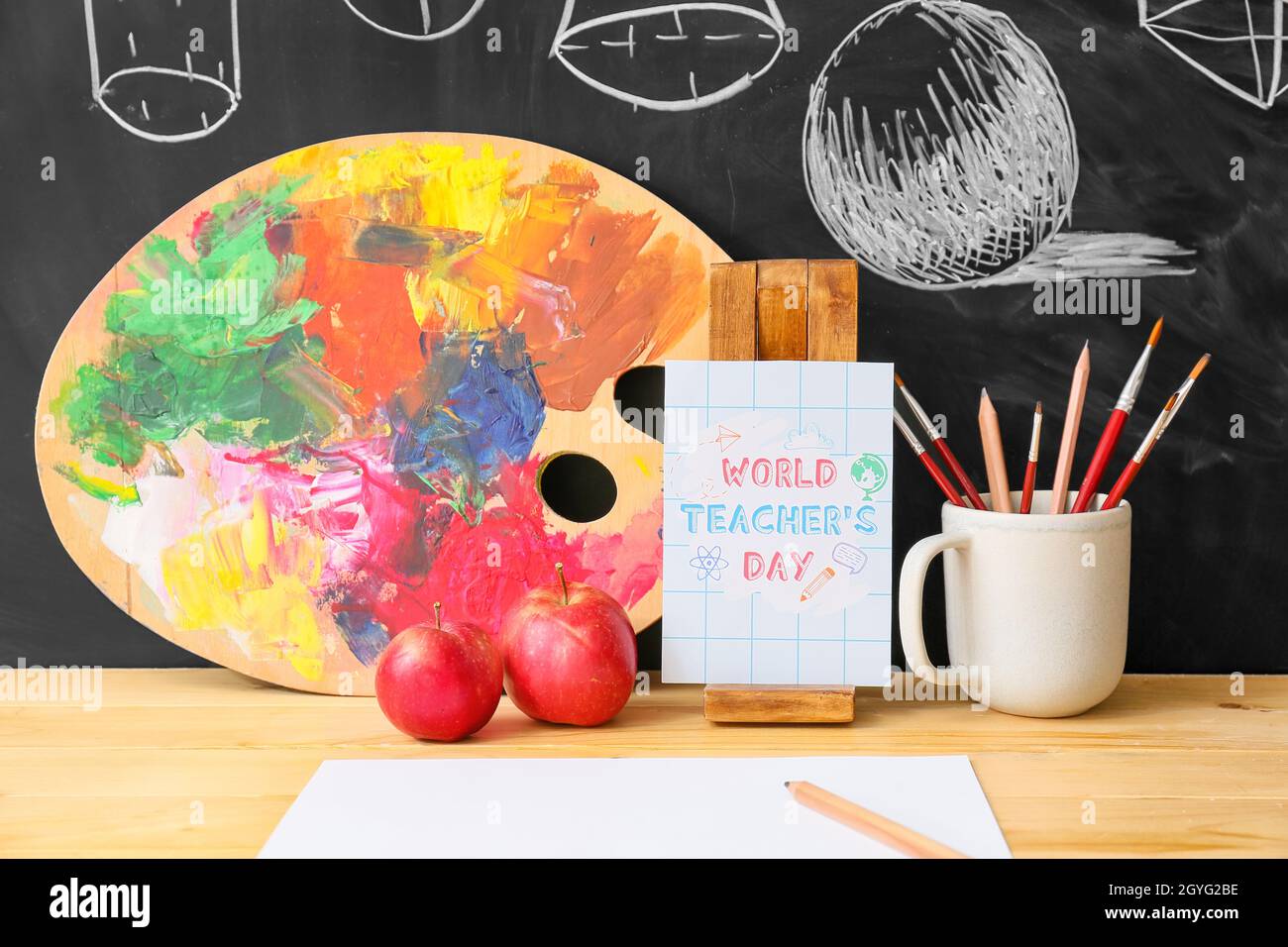 Composition with greeting card and drawing supplies on table in ...