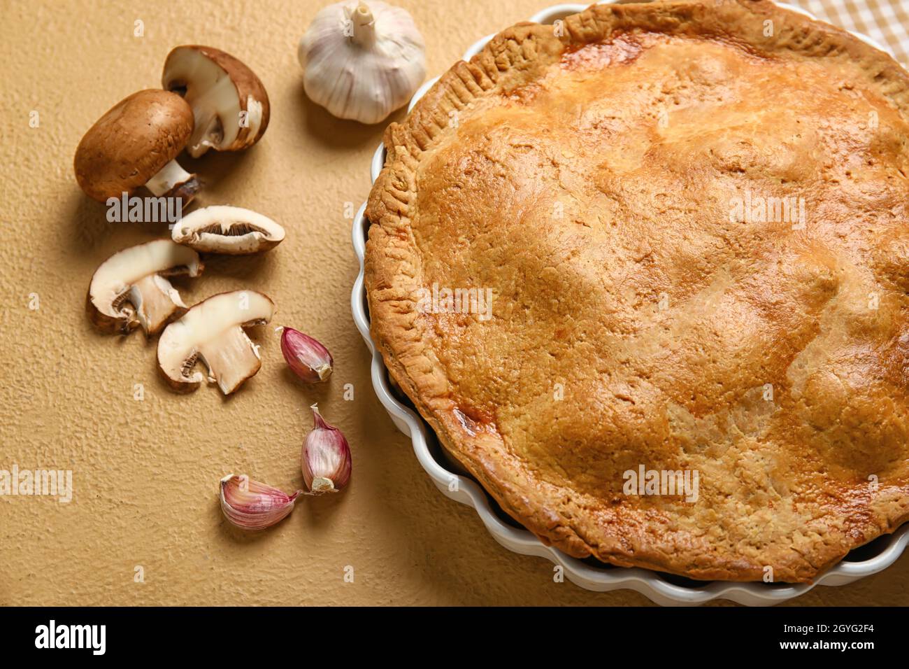 Baking dish with tasty chicken pot pie on beige background, closeup ...