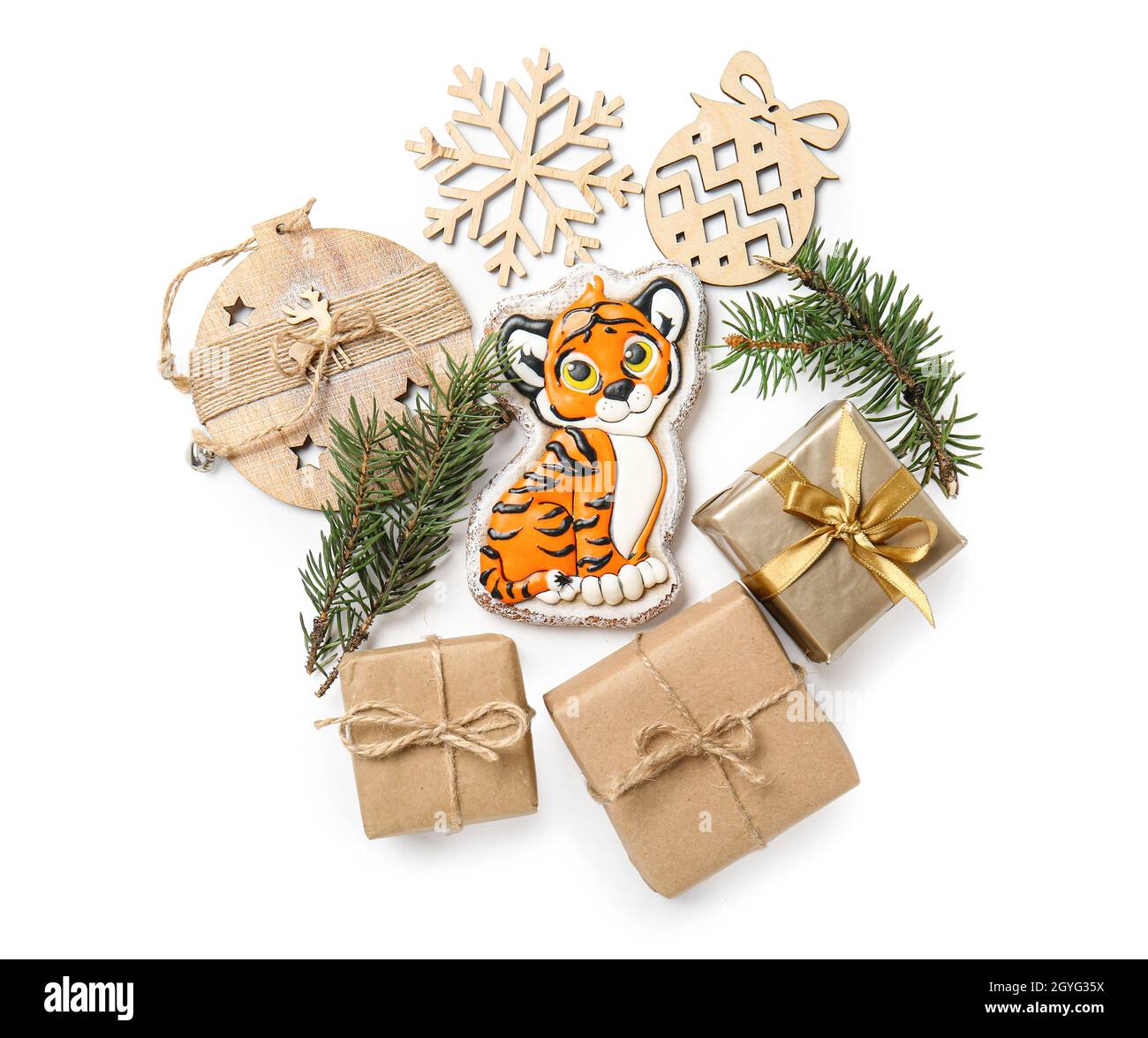 Cute cookie in shape of tiger, gifts and New Year decor on white ...