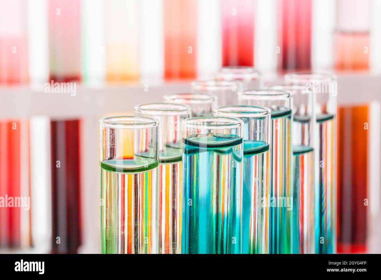 Glass laboratory chemical test tubes with liquid for analysis close up ...