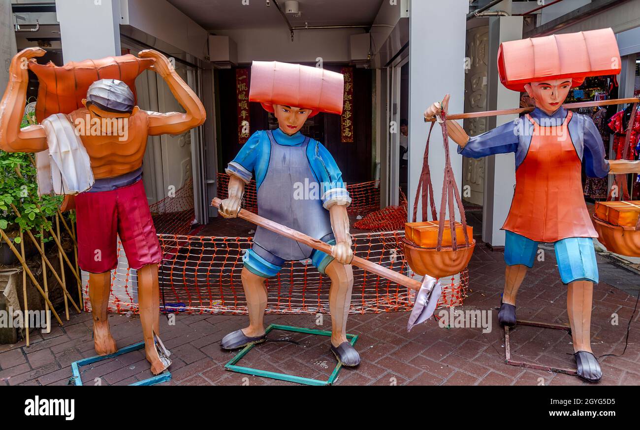 These three sculptures of working men are an example of the Chinese ...