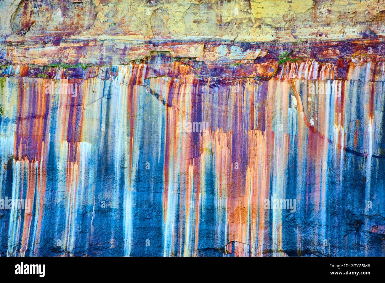 Pictured Rocks with blue, red, yellow and green stones Stock Photo - Alamy