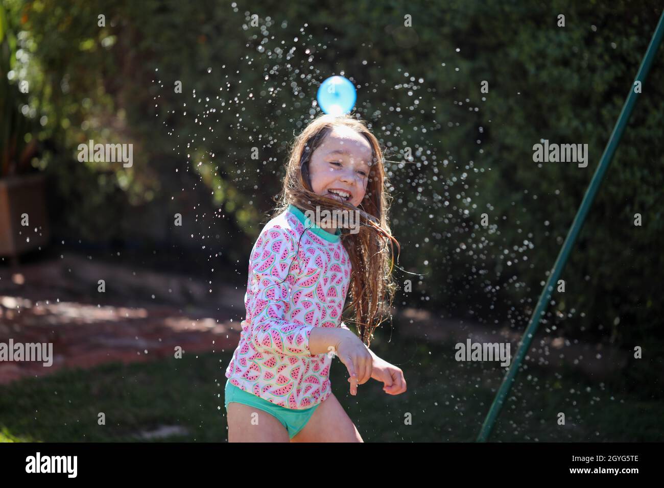 Water balloon fight kid hi-res stock photography and images - Alamy