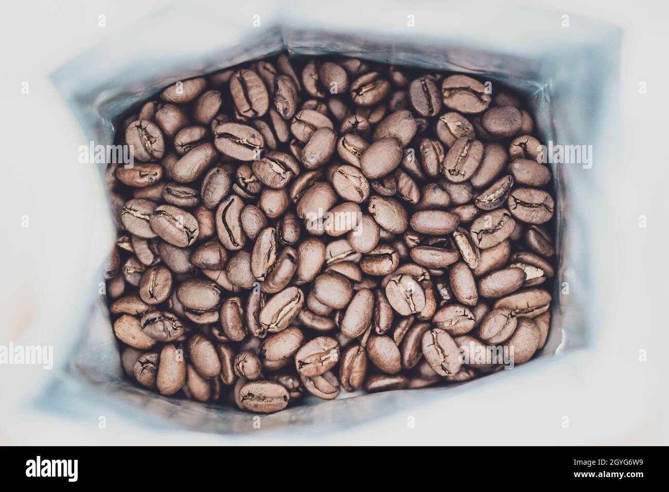 close-up of coffee beans in packaging bag, concept of simple natural ...