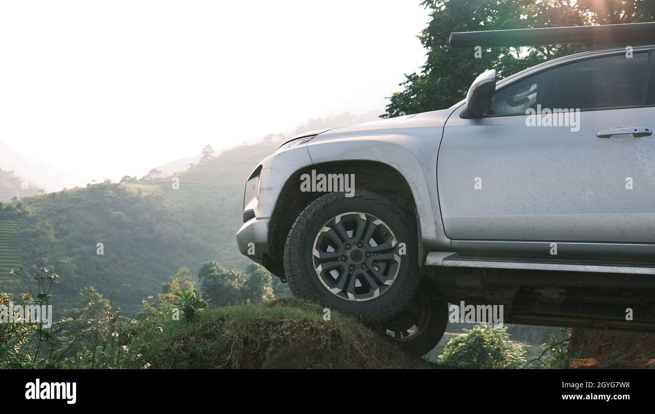 Traveling by pickup truck and camping with rooftop tent. Mitsubishi ...