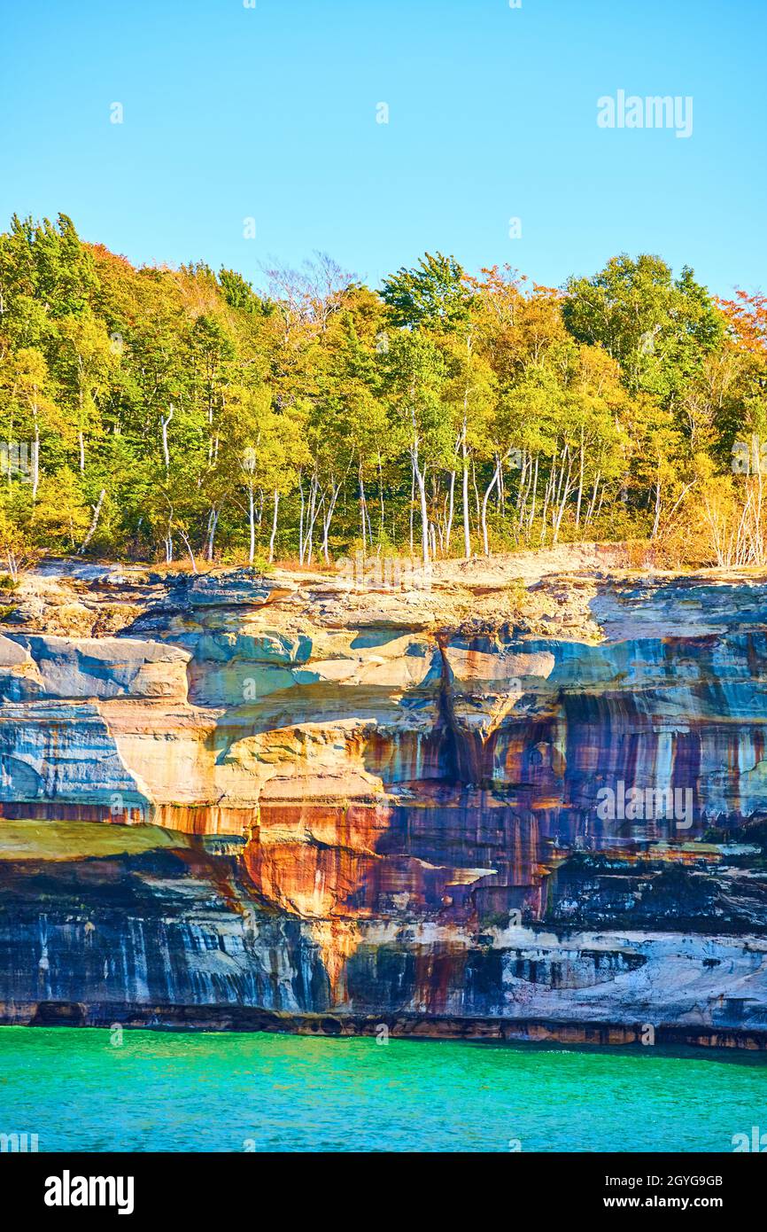 Pictured rocks with iron deposit making cliffs painted with streaks of ...