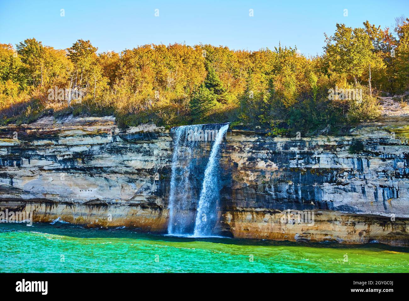 Pictured Rocks cliff coastal shot with waterfall Stock Photo - Alamy