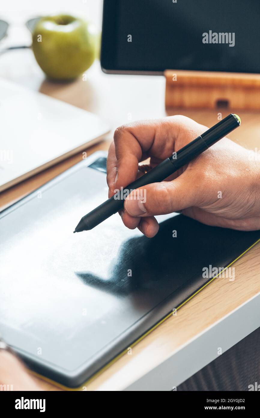 graphic designer using a pen tablet Stock Photo - Alamy