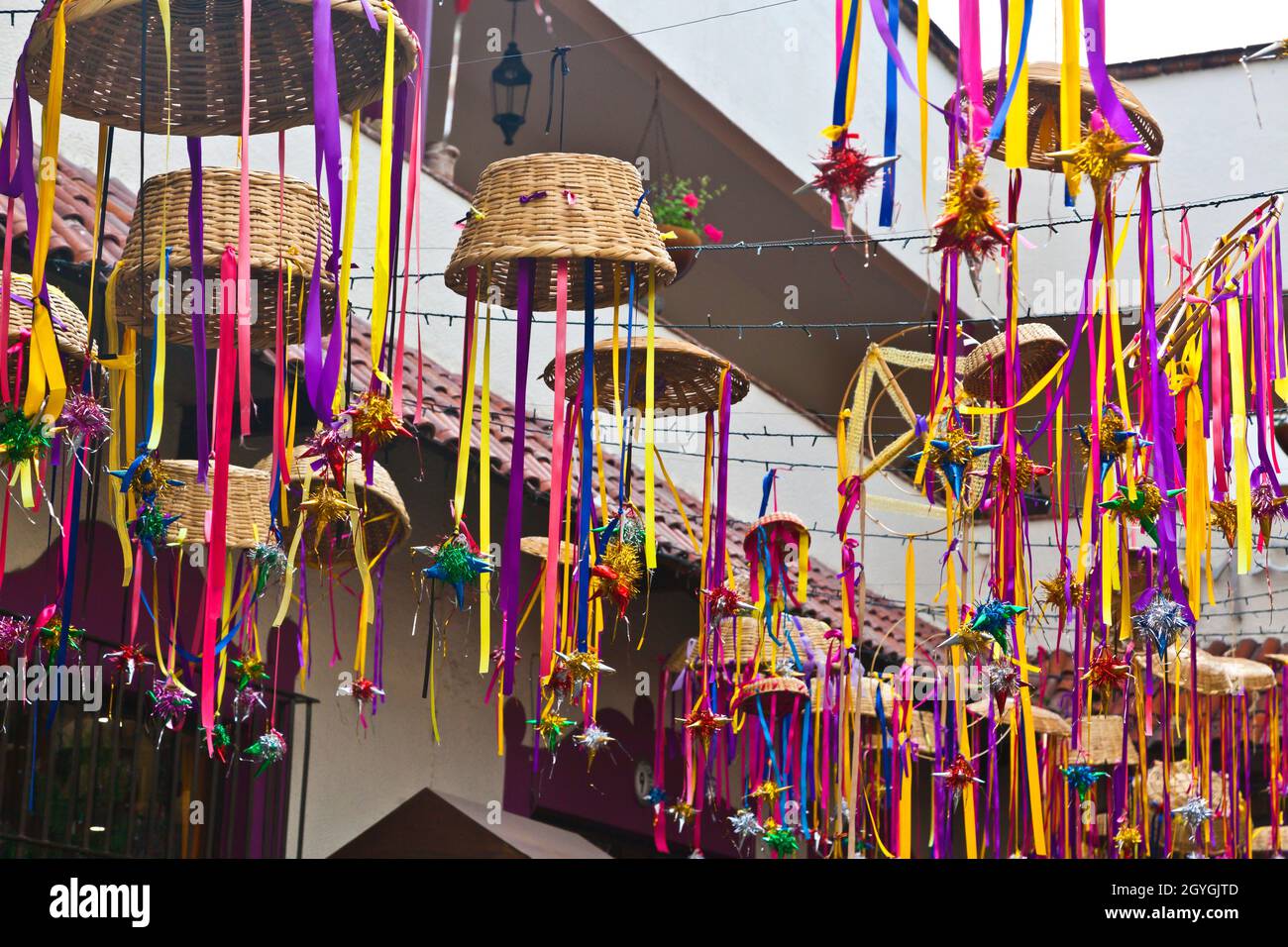 Mexican style lamps hang above a restaurant in TLAQUEPAQUE ...