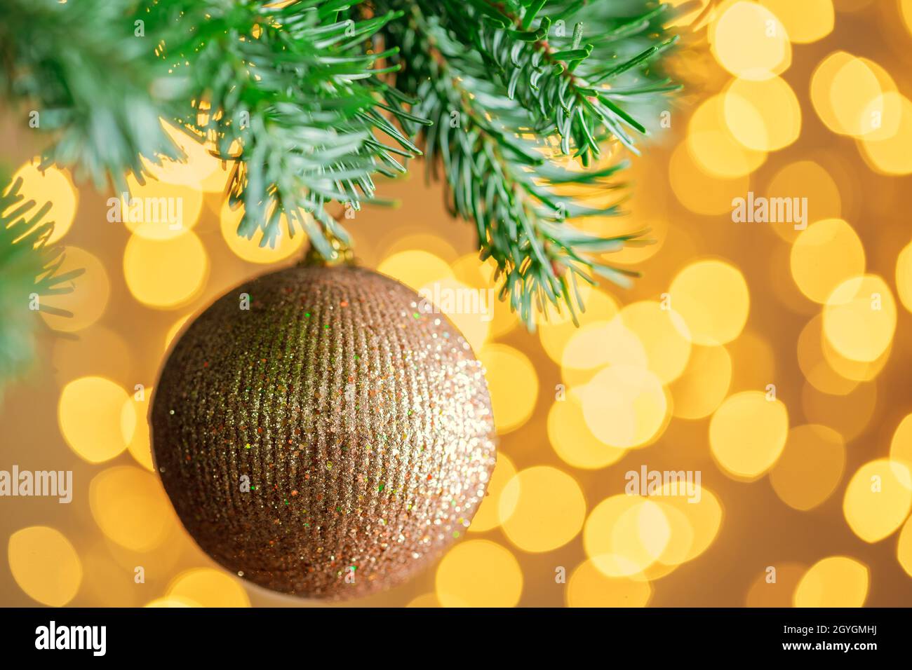 Christmas tree background with golden bauble on bokeh sparkling Stock ...