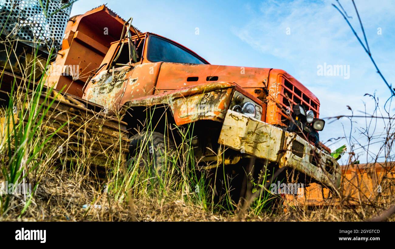 Broken old rusty truck in the junkyard Stock Photo - Alamy