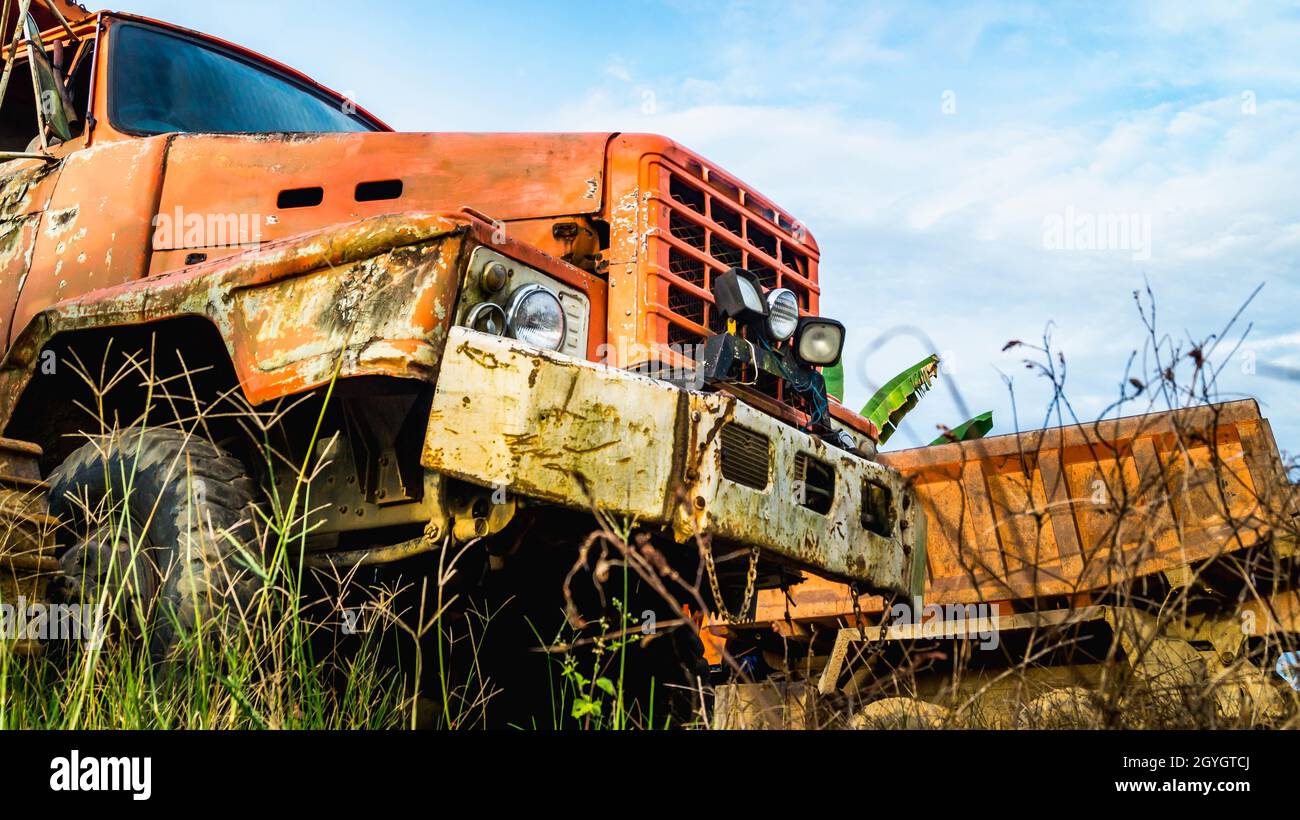 Broken old rusty truck in the junkyard Stock Photo - Alamy