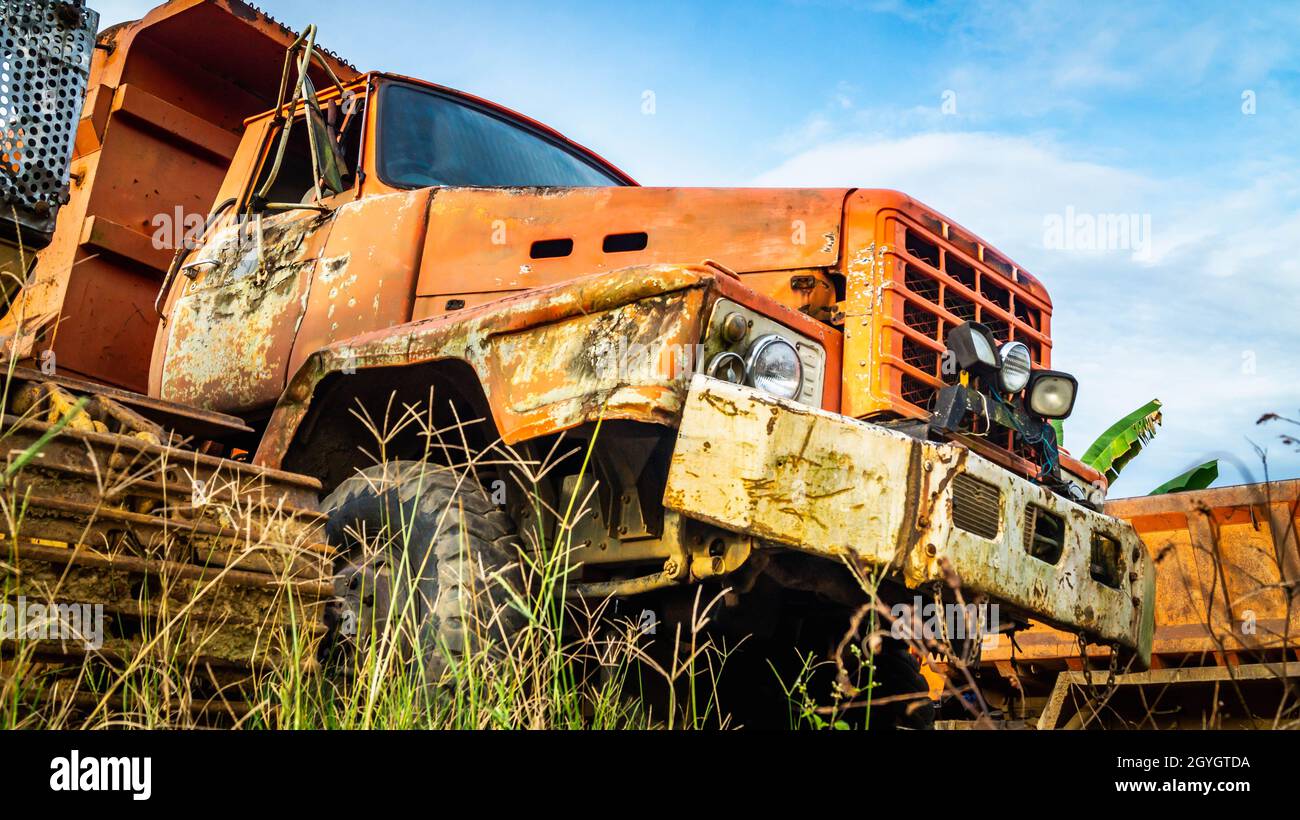 Broken old rusty truck in the junkyard Stock Photo - Alamy