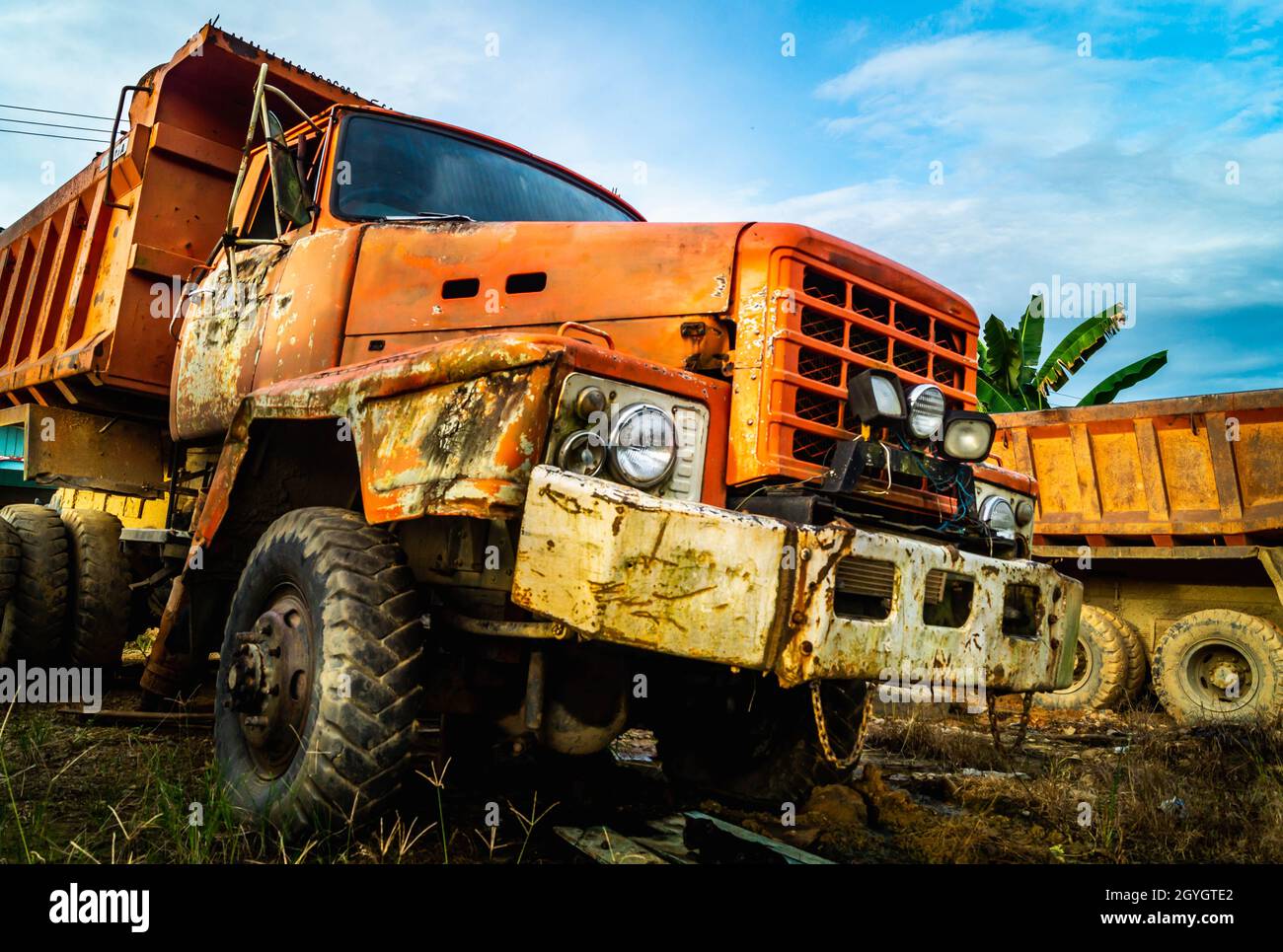 Broken old rusty truck in the junkyard Stock Photo - Alamy