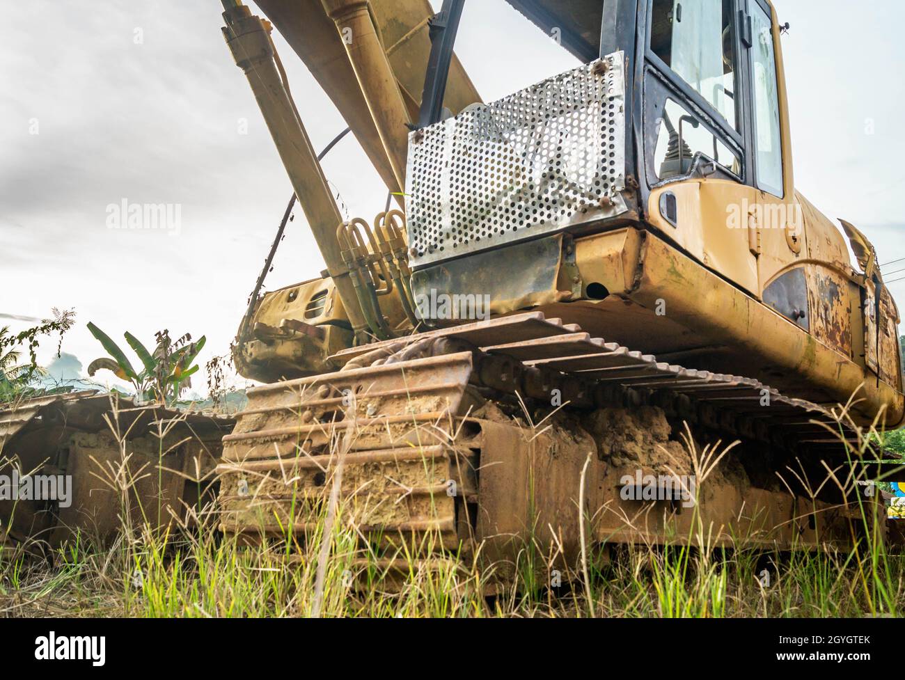 Old rusty excavator wreck in the junkyard Stock Photo - Alamy