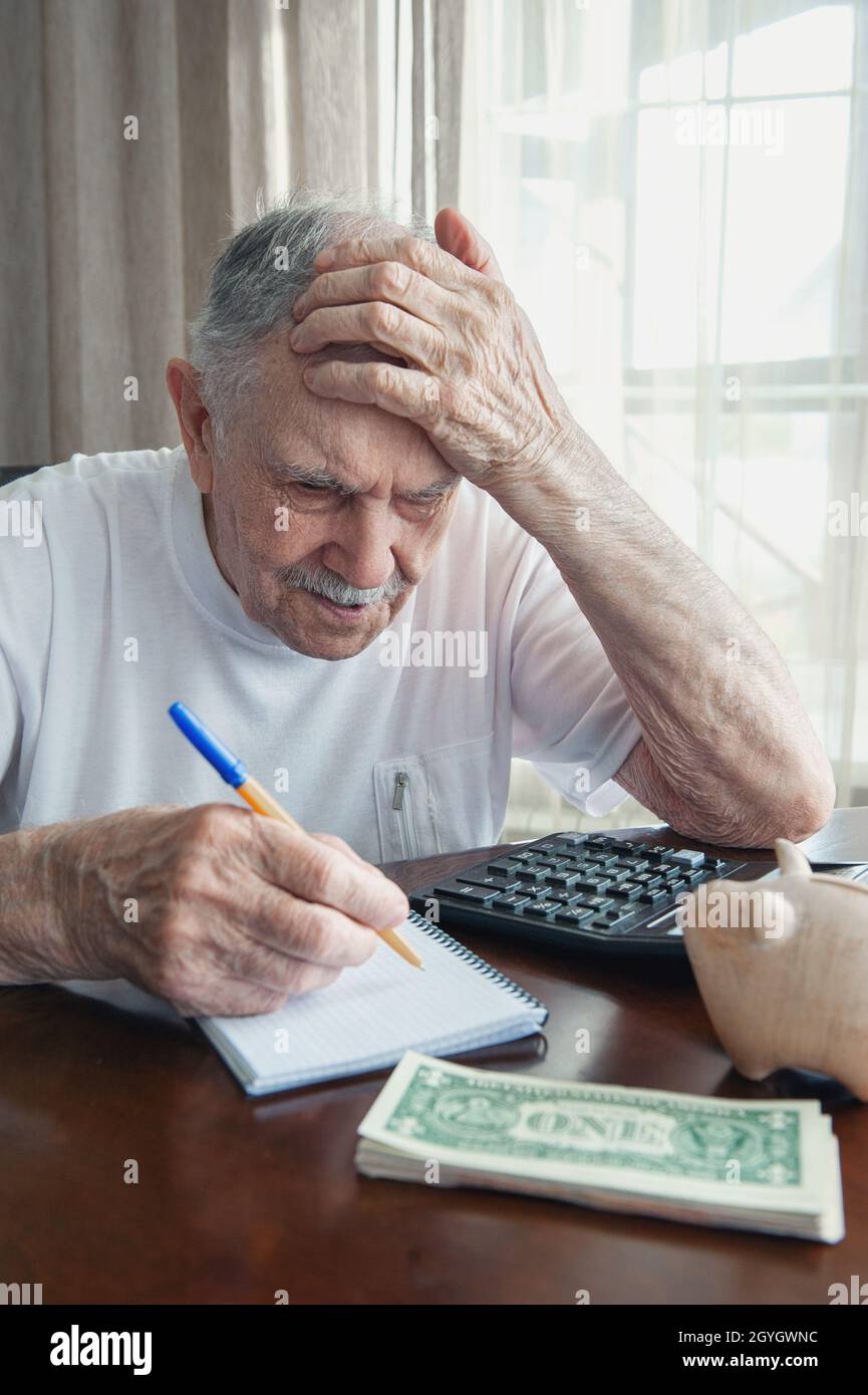 gray-haired handsome man of 88 years old in the concept of budget ...
