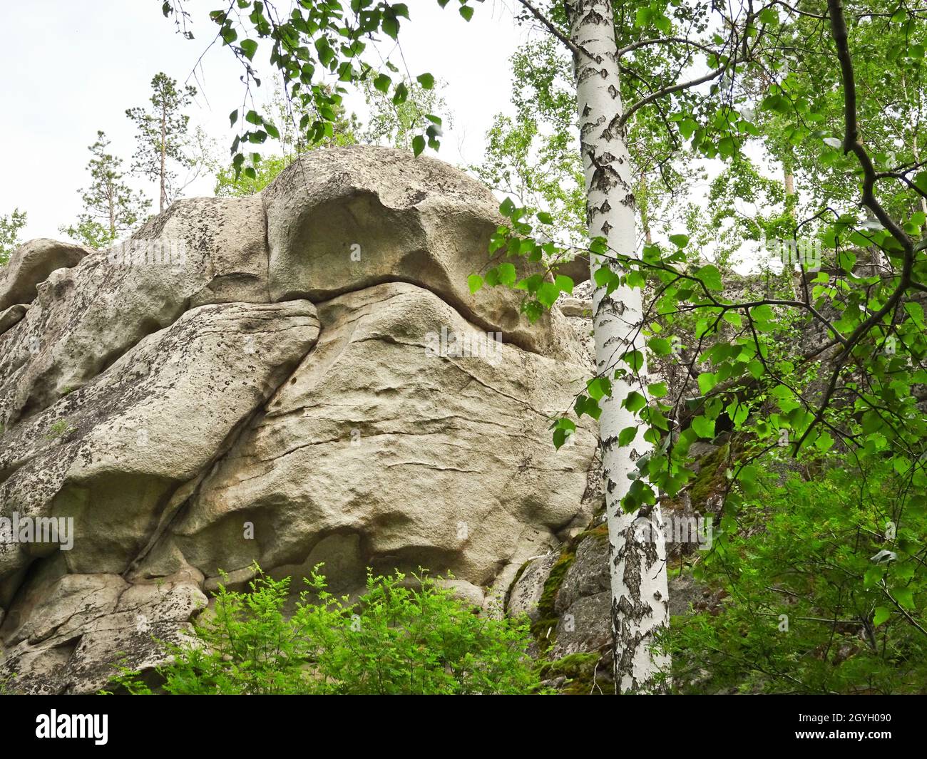Rocks with swollen edges. Granite rock massif of the Middle Urals ...