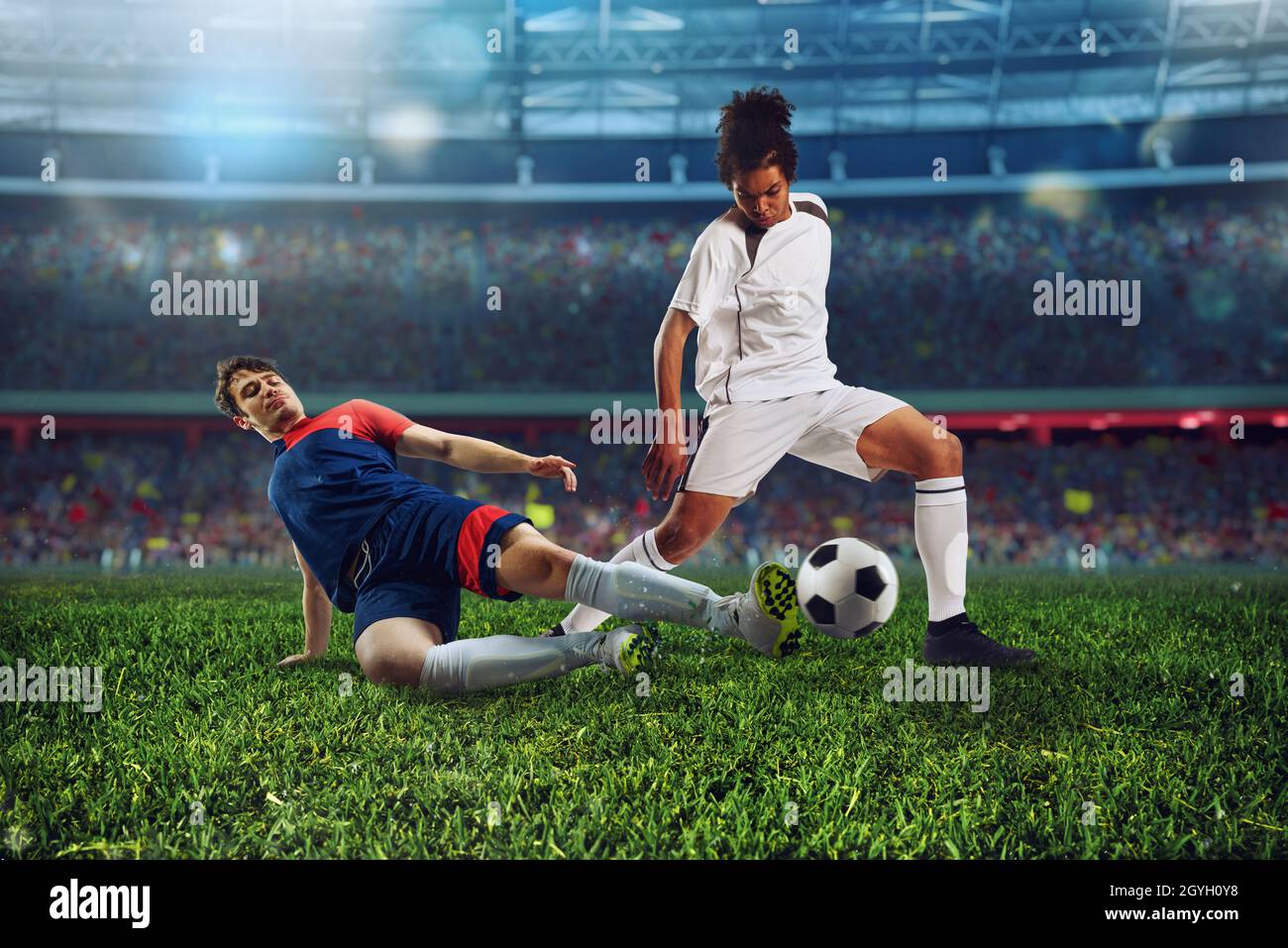 Football scene with competing football players at the stadium Stock ...
