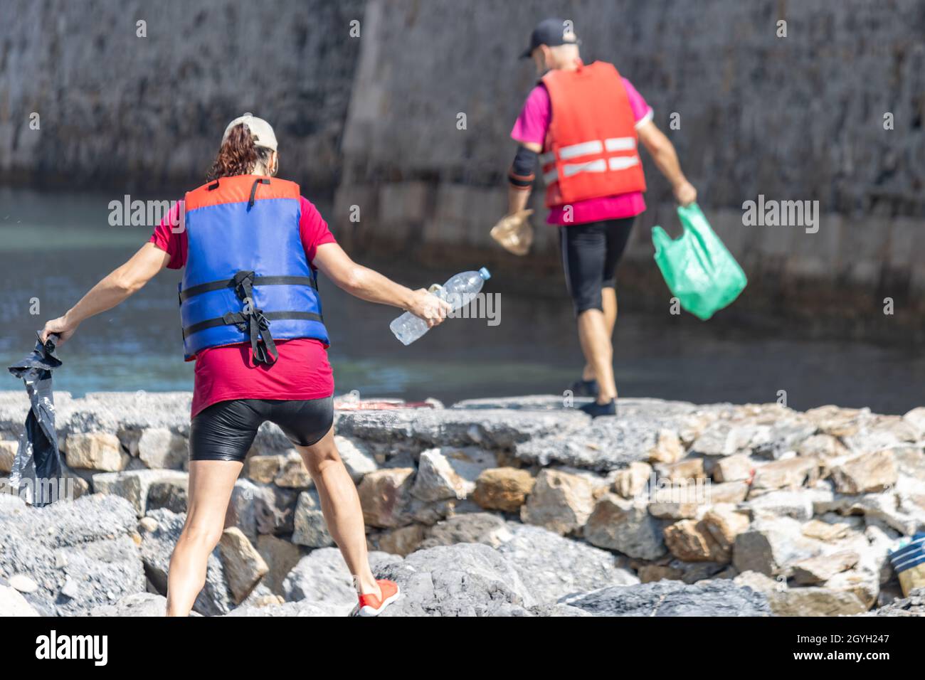 Volunteers collect plastic garbage hi-res stock photography and images ...