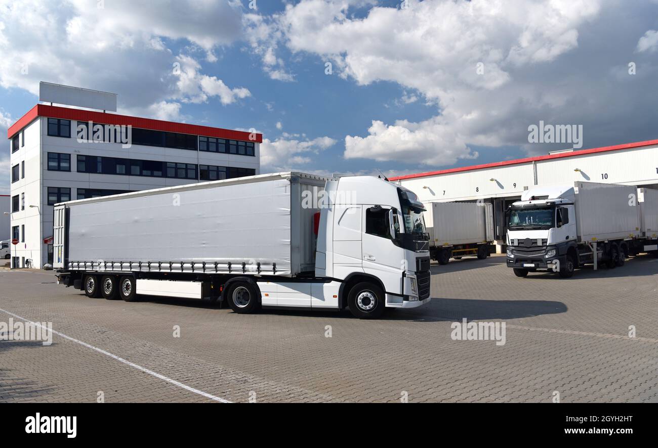 Trucks loading at a depot of a forwarding agency - Transport and ...