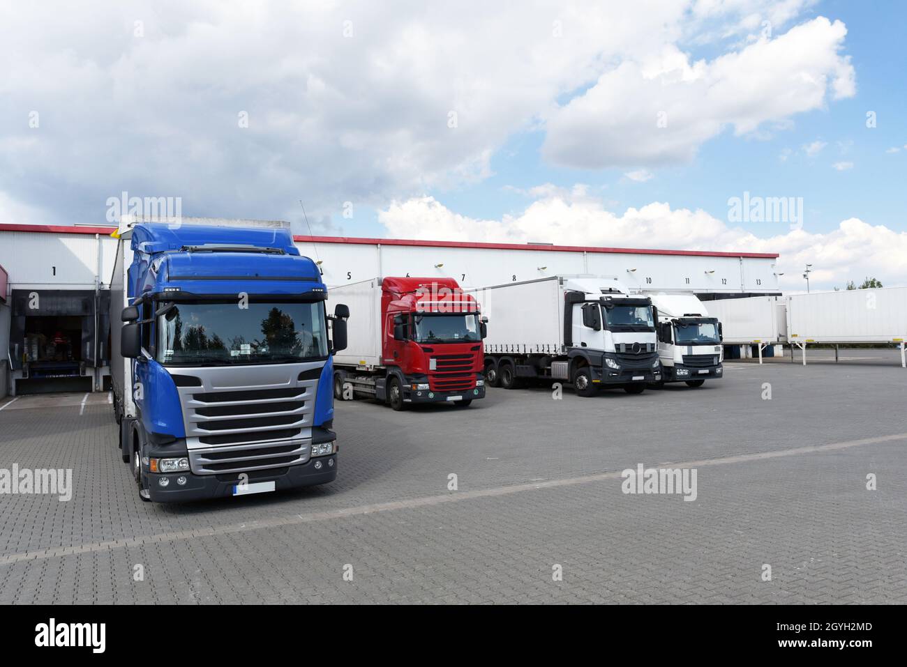 Trucks loading at a depot of a forwarding agency - Transport and ...