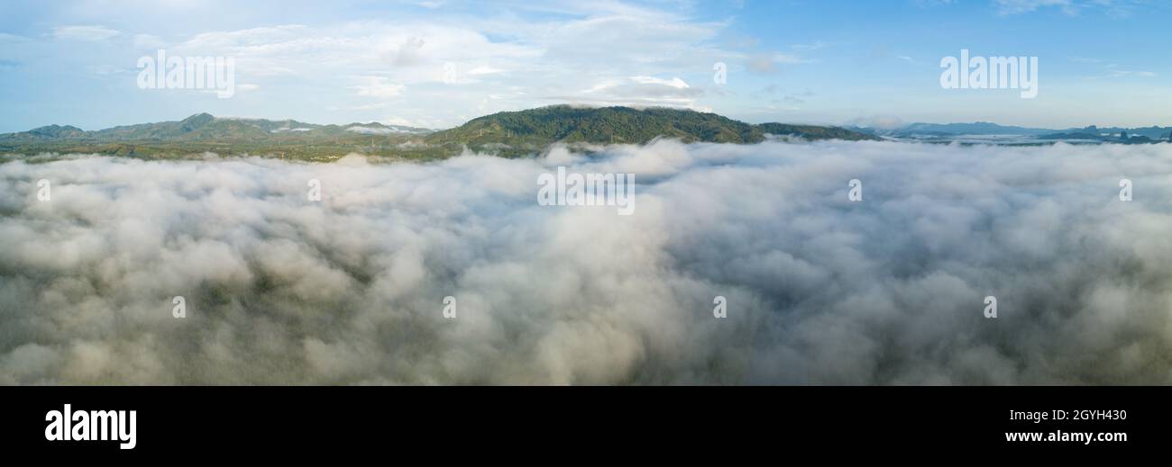Aerial view Panorama of flowing fog waves on mountain tropical ...