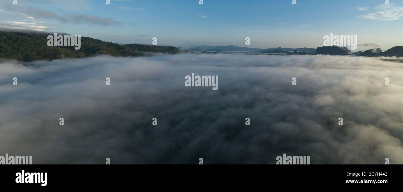 Aerial view Panorama of flowing fog waves on mountain tropical ...