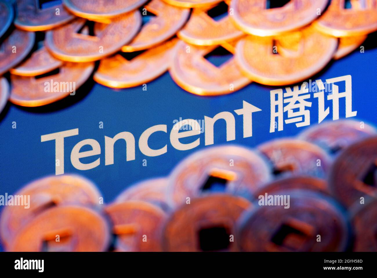 Tencent logo surrounded by blurred feng shui coins Stock Photo - Alamy
