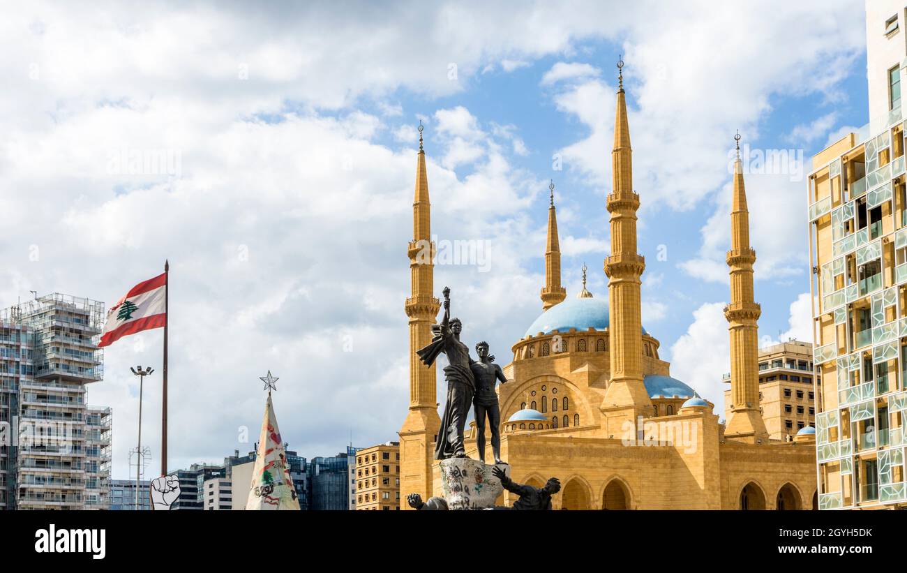 Old historic statue in Martyrs' square with al-Amin mosque and Lebanese ...