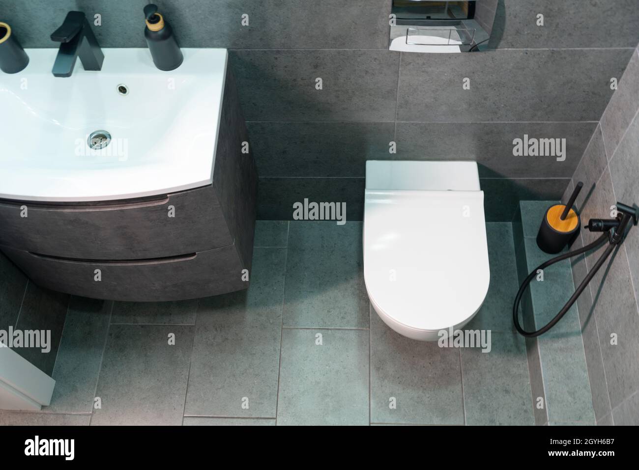 Top down view on a compact modern bathroom with WC and single vanity ...