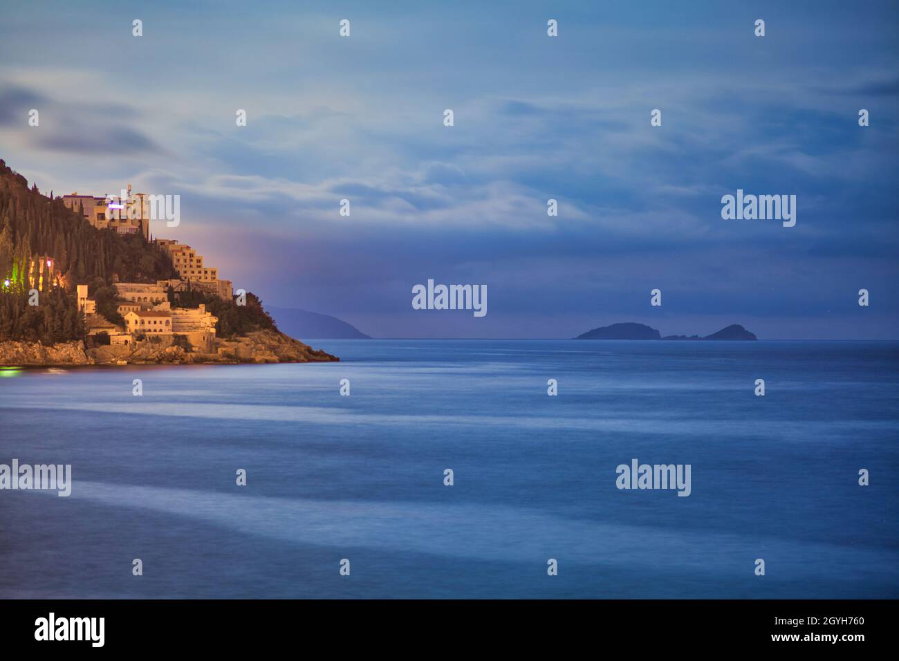 Beautiful scenery of an island with buildings by the ocean Stock Photo ...
