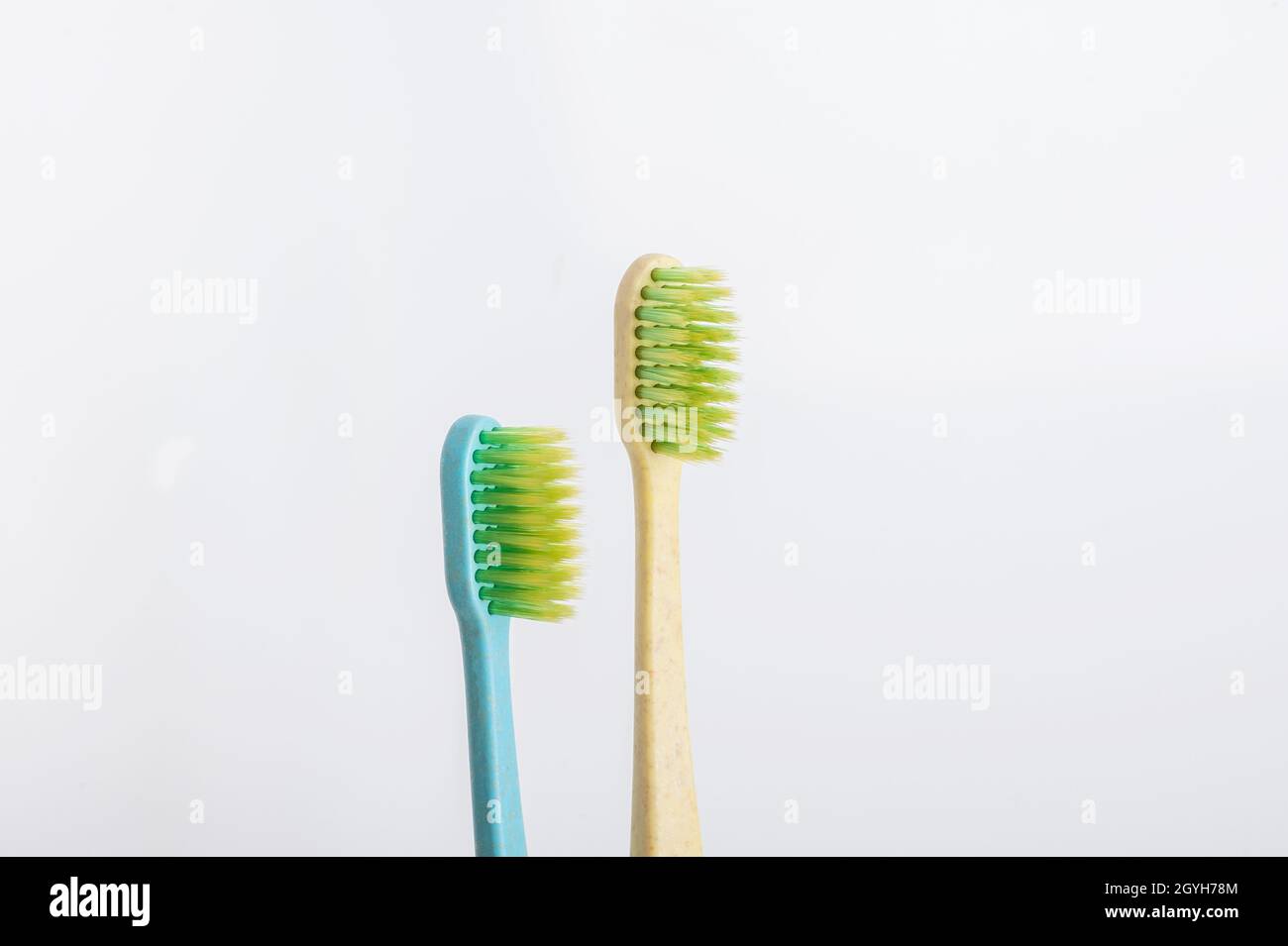 Two toothbrushes, close up, isolated on white Stock Photo - Alamy
