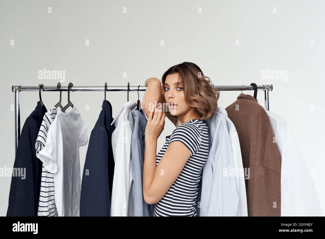 beautiful woman trying on clothes shop retail isolated background Stock ...