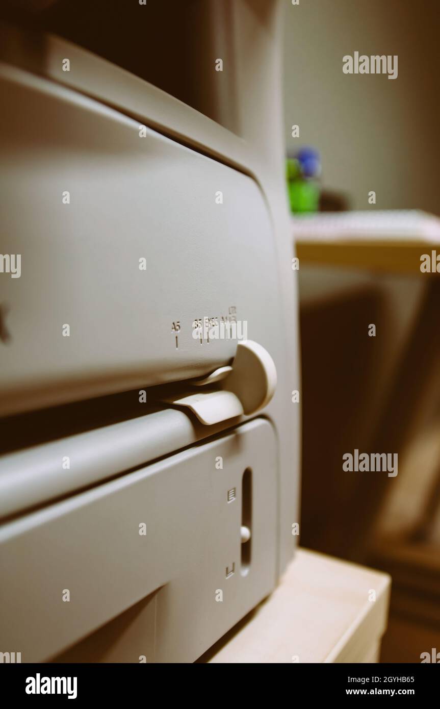 Side view of design printer in office with A paper size engraved on ...