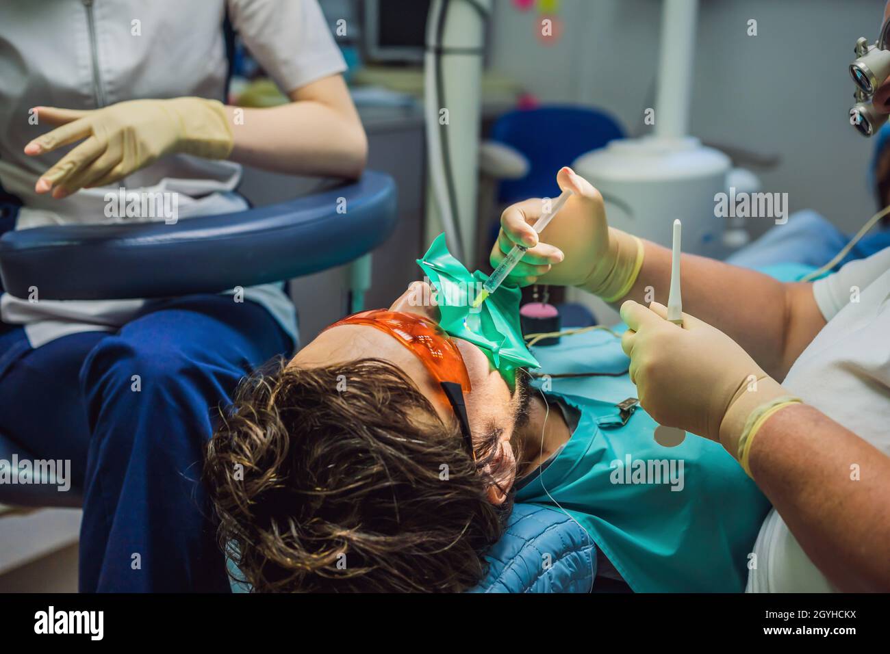 Man having teeth examined at dentists. Dental treatment in dentistry ...