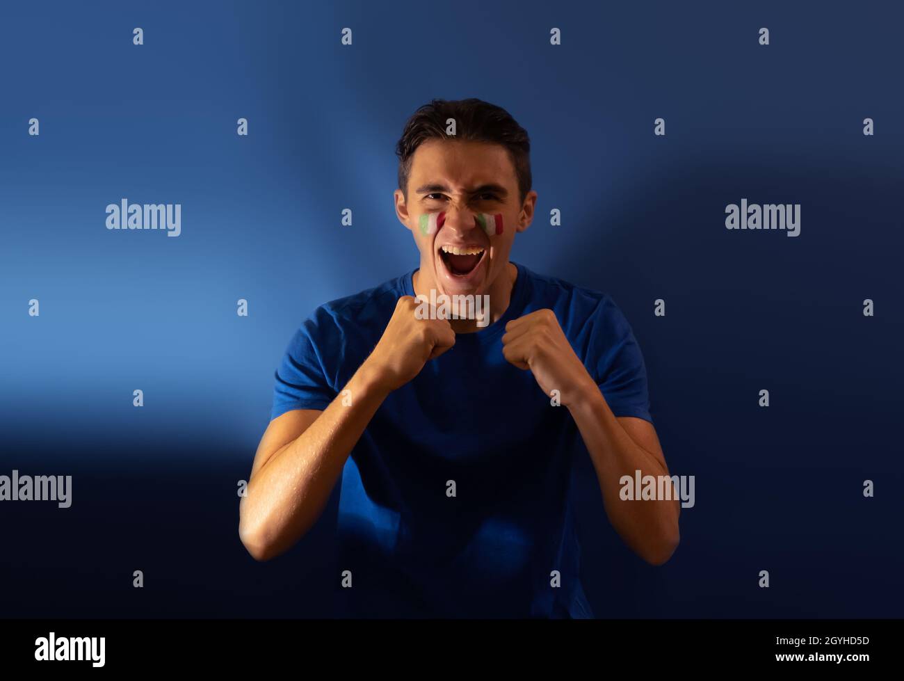 italian football fan shouting for his national team, isolated on blue ...