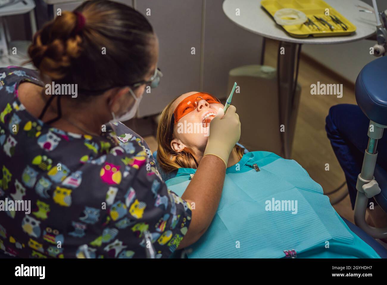 Woman having teeth examined at dentists. Dental treatment in dentistry ...