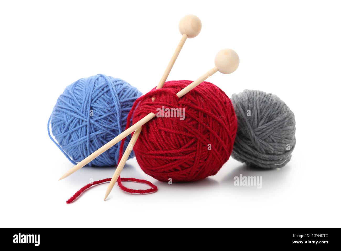 Multi colored balls of yarn with knitting needles, isolated on white ...