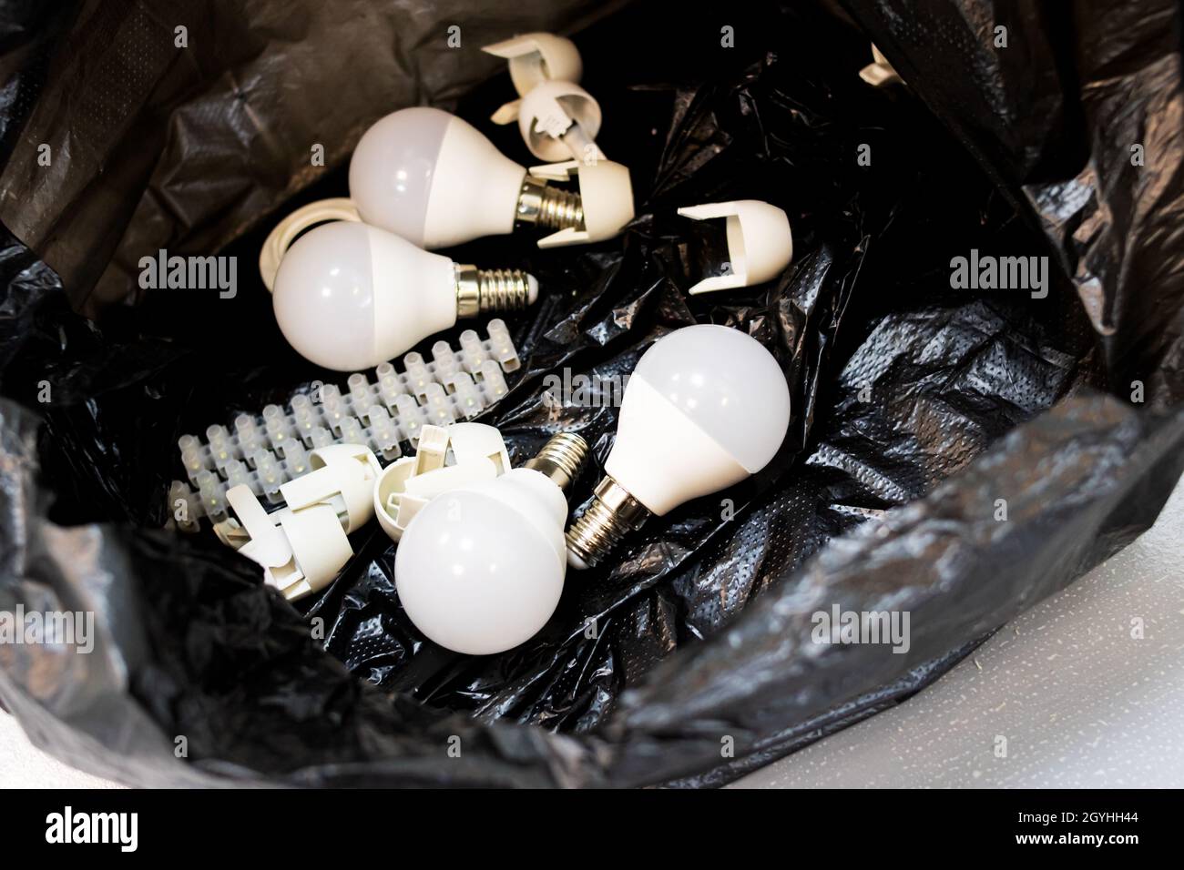 A bunch of light bulbs in a black bag close up Stock Photo - Alamy