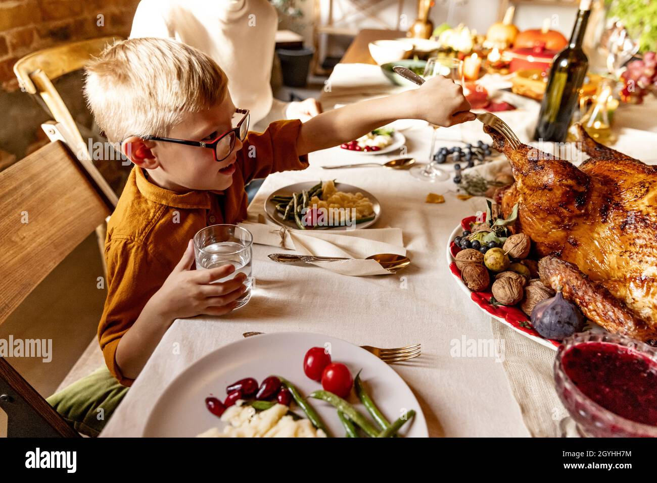 Little cute boy, kid visits grandparents and celebrate Thanksgiving day ...
