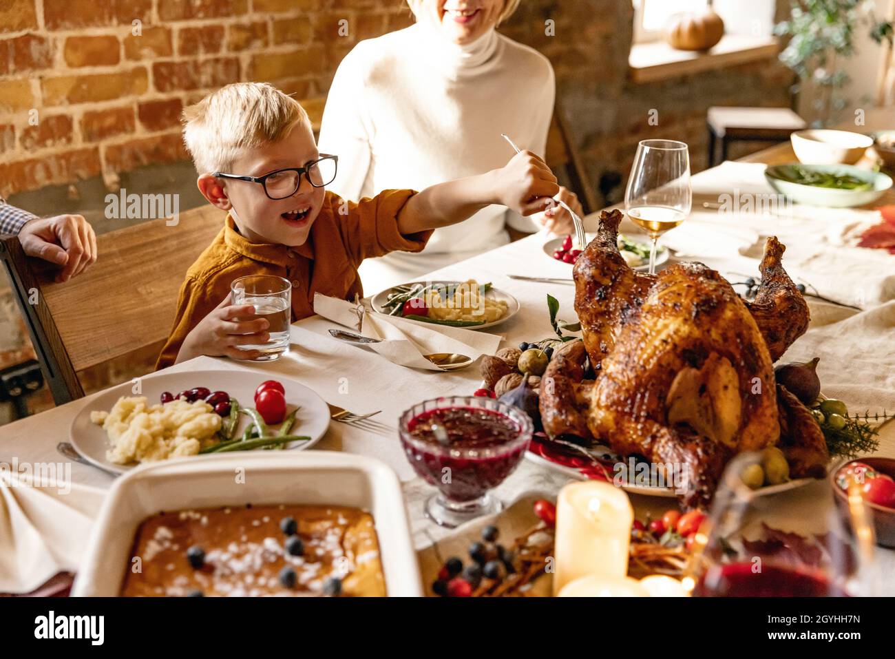 Little cute boy, kid visits grandparents and celebrate Thanksgiving day ...